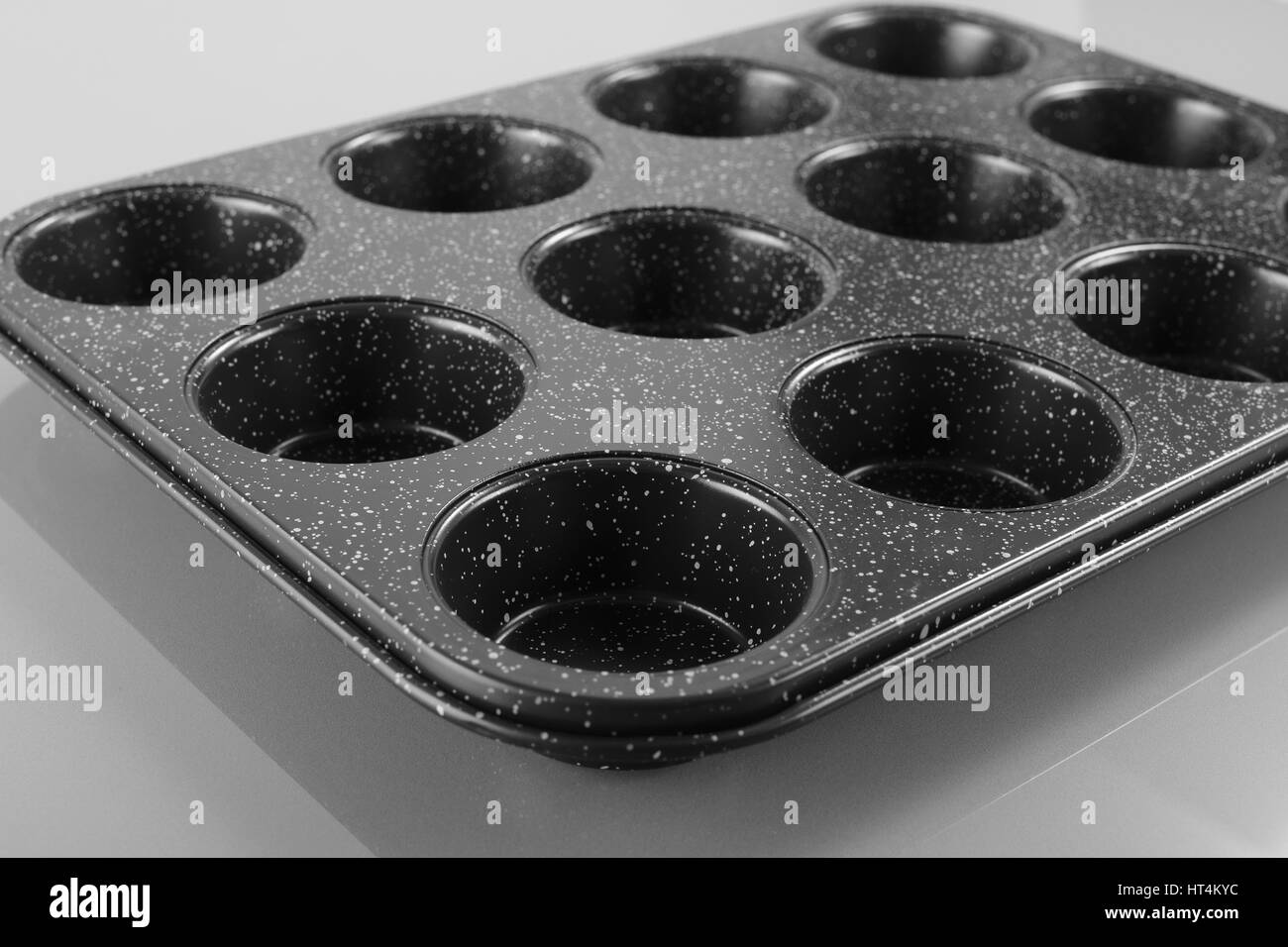 Cooking, baking and home concept. Close up of empty muffins molds Stock ...