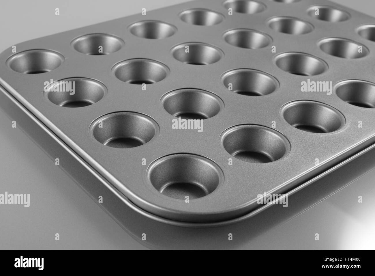 Cooking, baking and home concept. Close up of empty muffins molds Stock ...