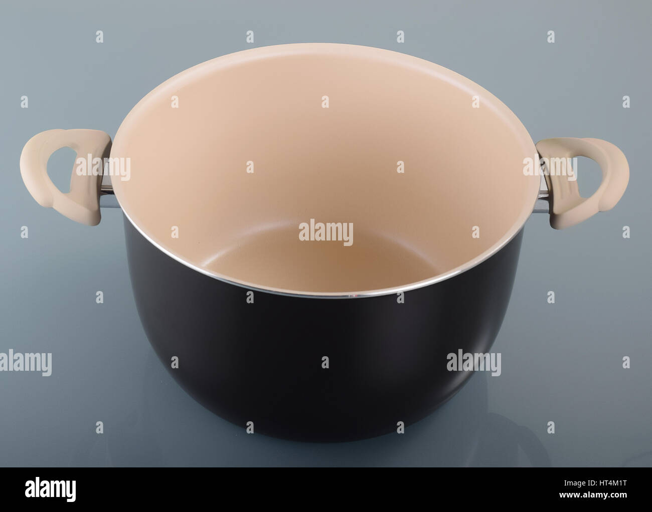 Deep pan with handles on gray background Stock Photo - Alamy