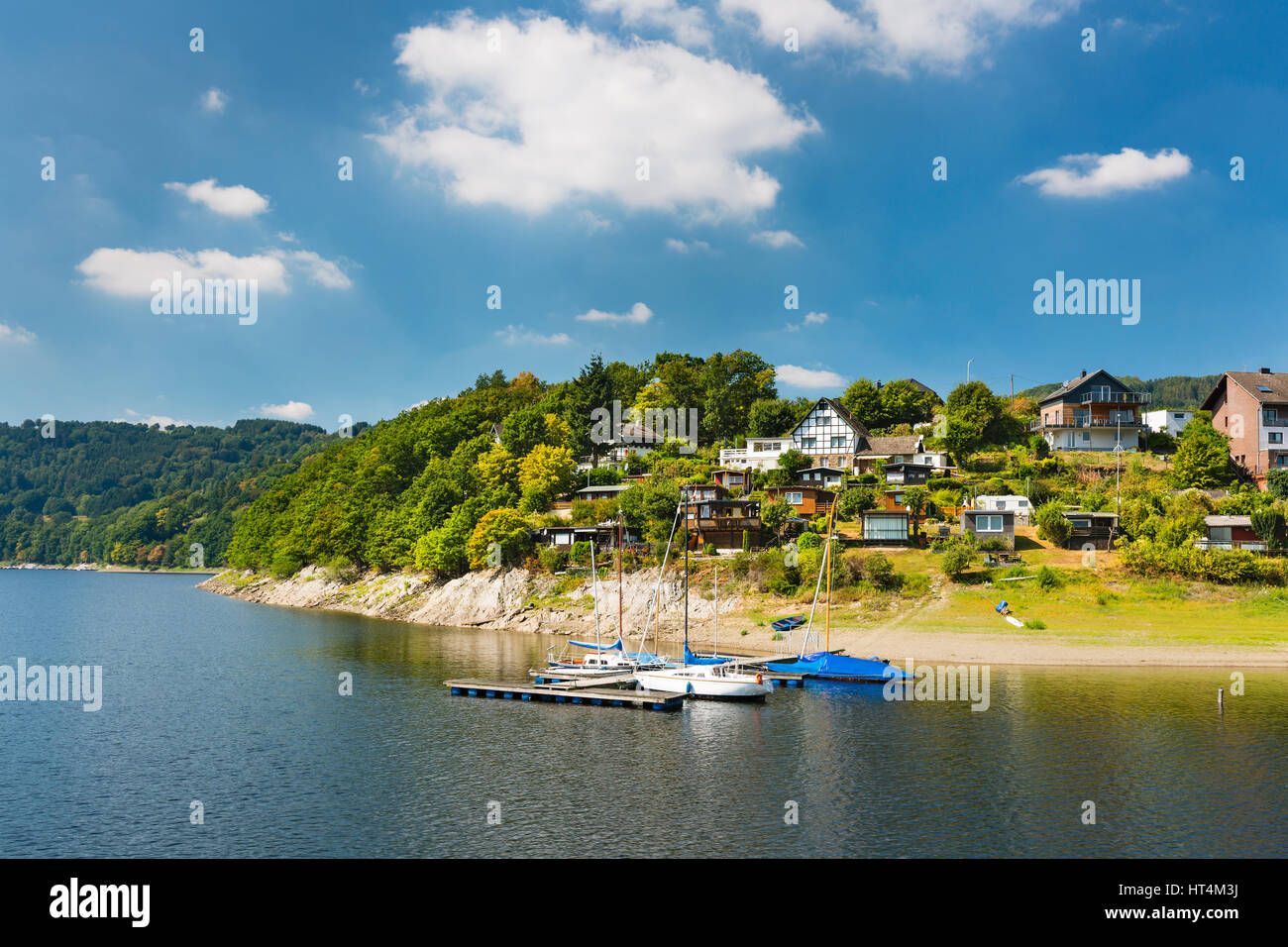 Woffelsbach lake front at Lake Rursee with perfect blue sky and a ...