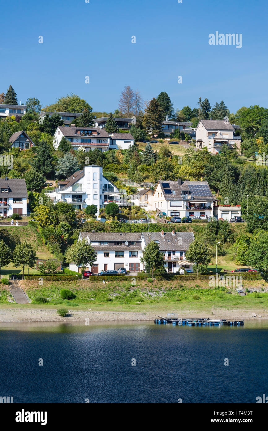 Houses of the village Rurberg at Lake Rursee with perfect blue sky in ...