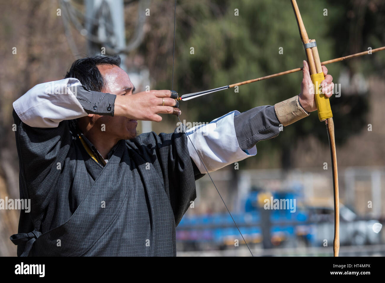 Bhutan, Thimphu, capital of Bhutan. Local archery competition played in ...