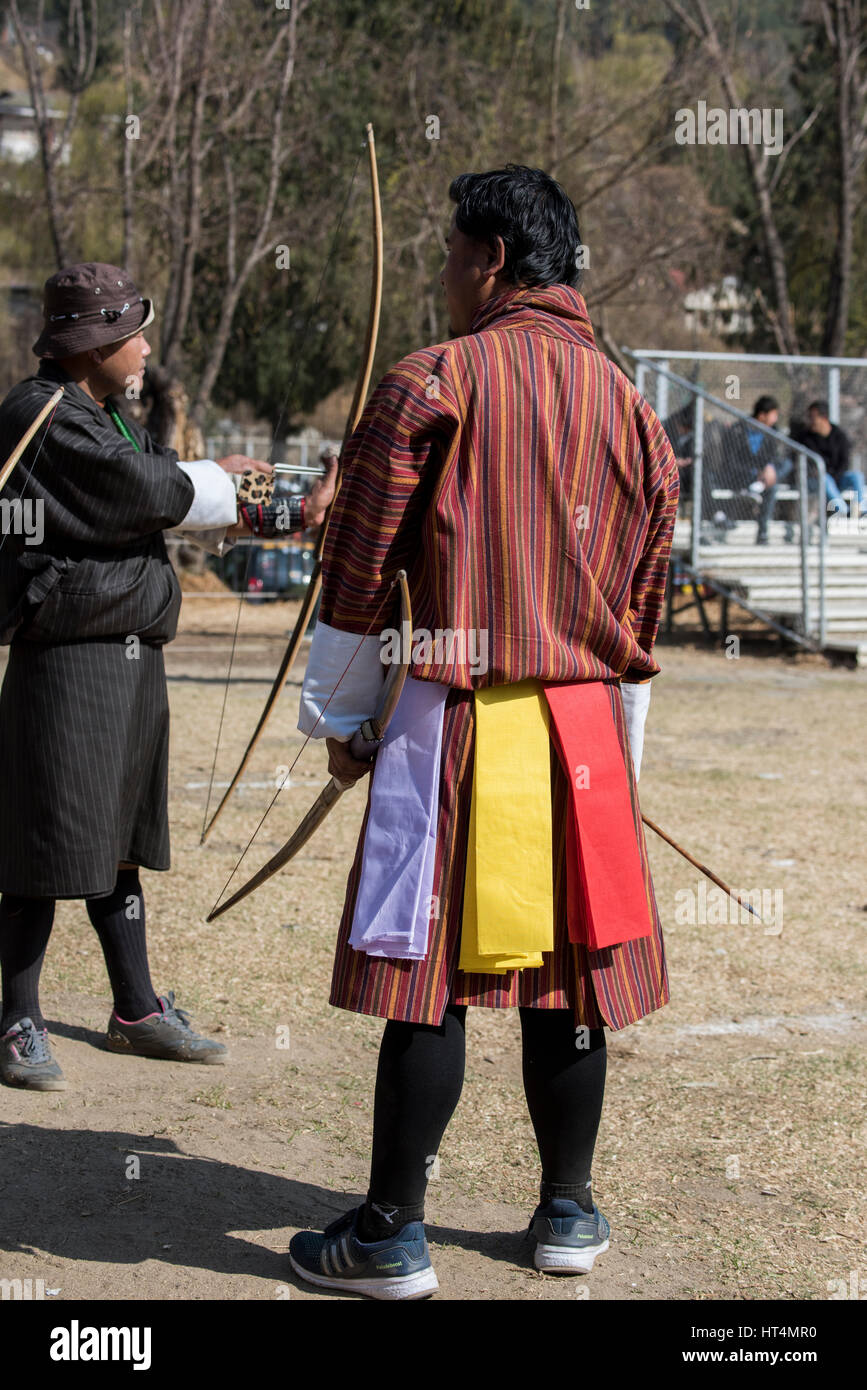 Bhutan, Thimphu, capital of Bhutan. Local archery competition played in ...