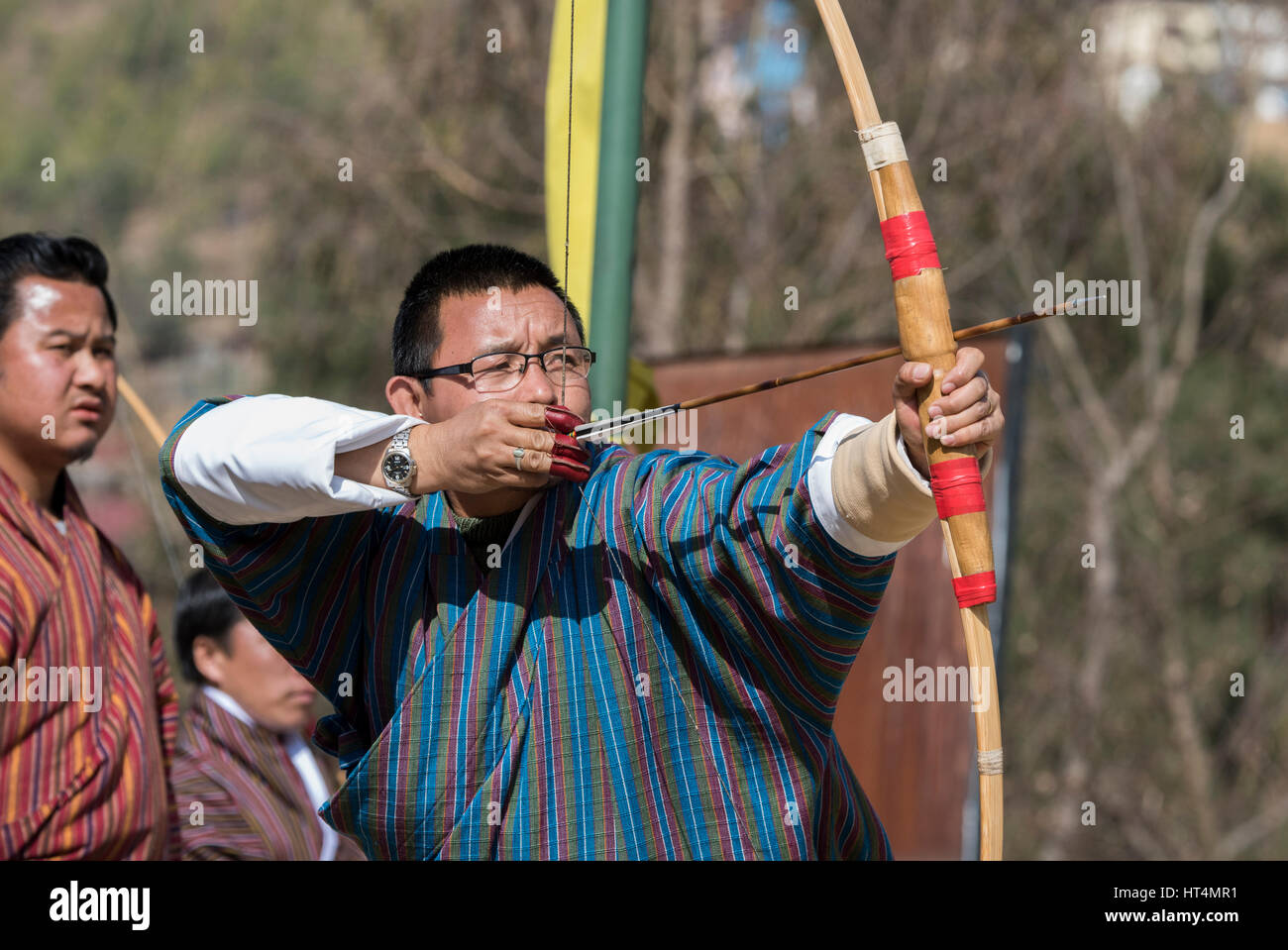 Bhutan, Thimphu, capital of Bhutan. Local archery competition played in ...