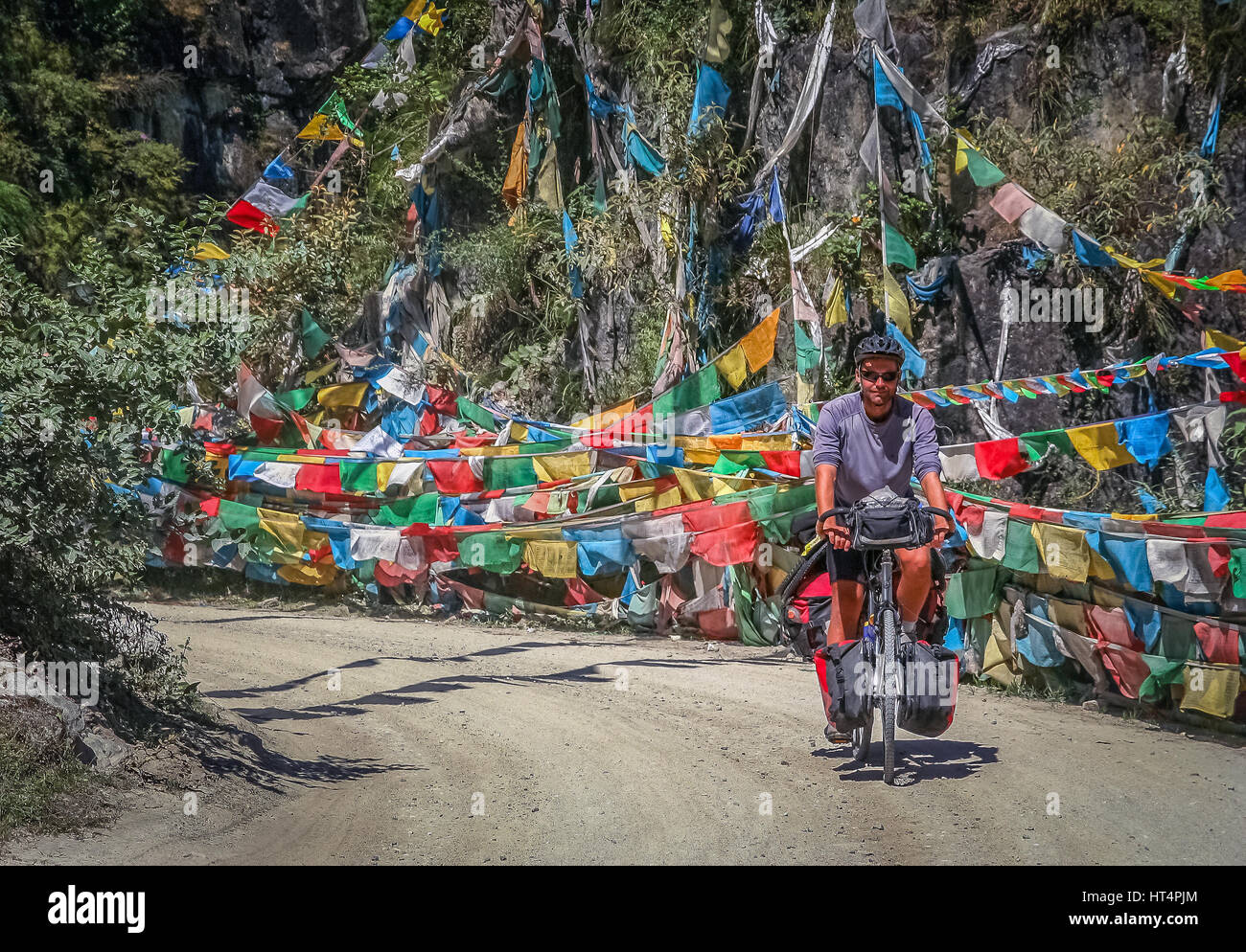 Man on a cycle touring trip in Yunnan Province, China Stock Photo - Alamy
