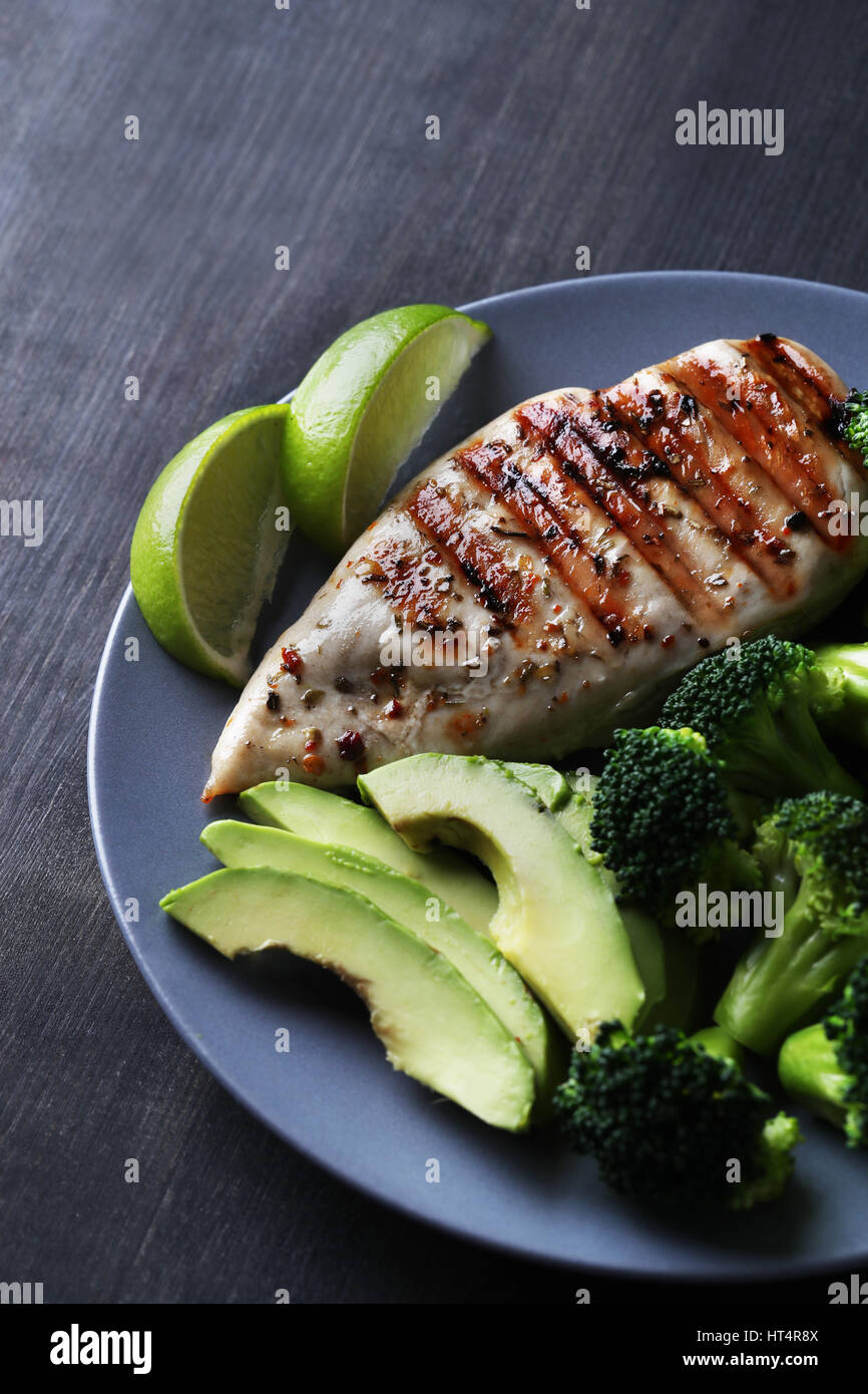 Dinner. Fried chicken fillet with vegetables Stock Photo - Alamy