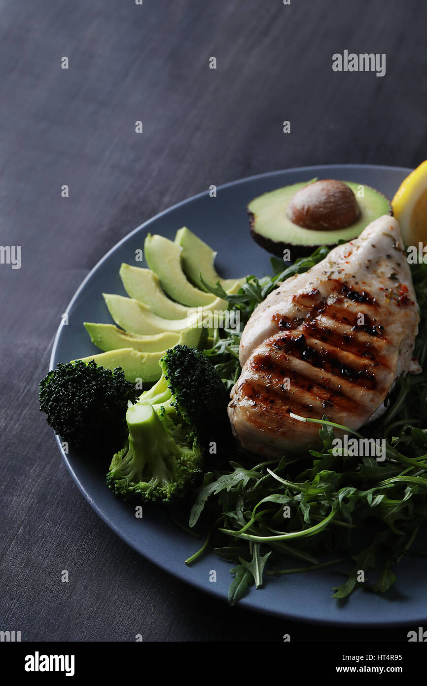 Dinner. Fried chicken fillet with vegetables Stock Photo - Alamy