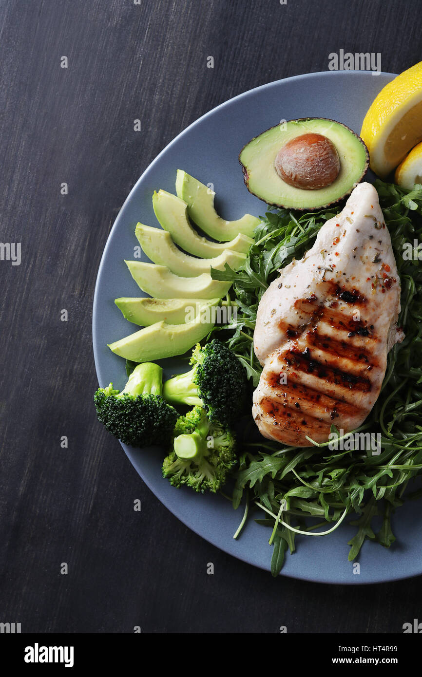 Dinner. Fried chicken fillet with vegetables Stock Photo - Alamy