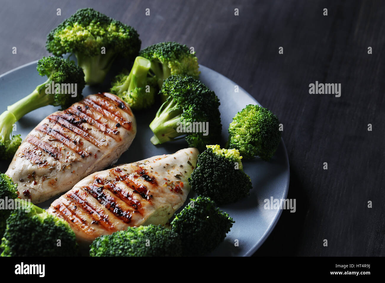 Dinner. Fried chicken fillet with vegetables Stock Photo - Alamy