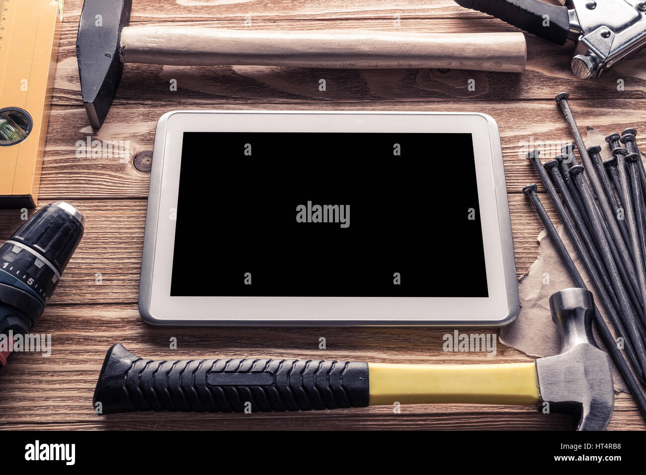 Variety of tools of builder and tablet pc on wooden texture table Stock ...