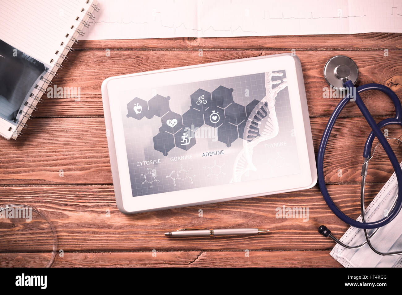 White tablet pc and doctor tools on wooden table Stock Photo - Alamy