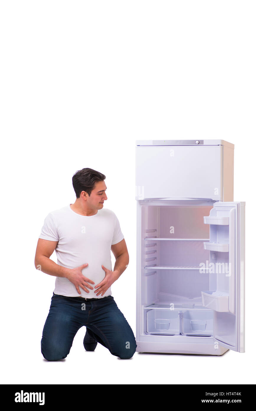 Man looking for food in empty fridge Stock Photo - Alamy