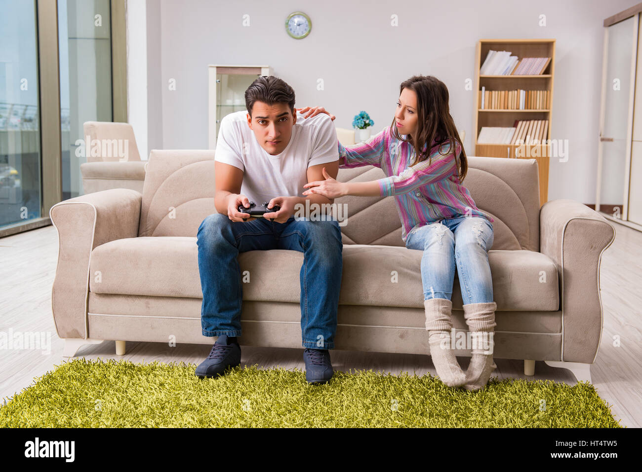 Young family suffering from computer games addiction Stock Photo - Alamy