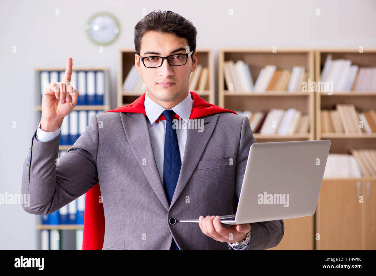 Superhero businessman working in the office Stock Photo - Alamy