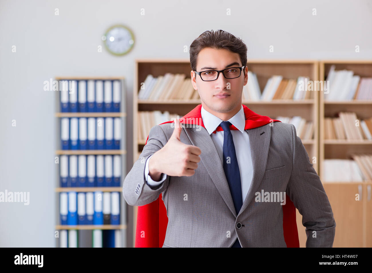 Superhero businessman working in the office Stock Photo - Alamy