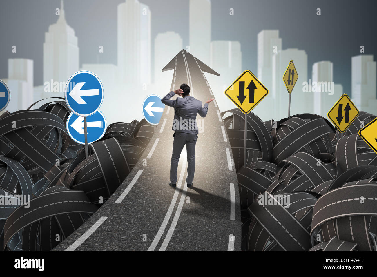 Businessman in uncertainty concept on road intersection crossroads ...