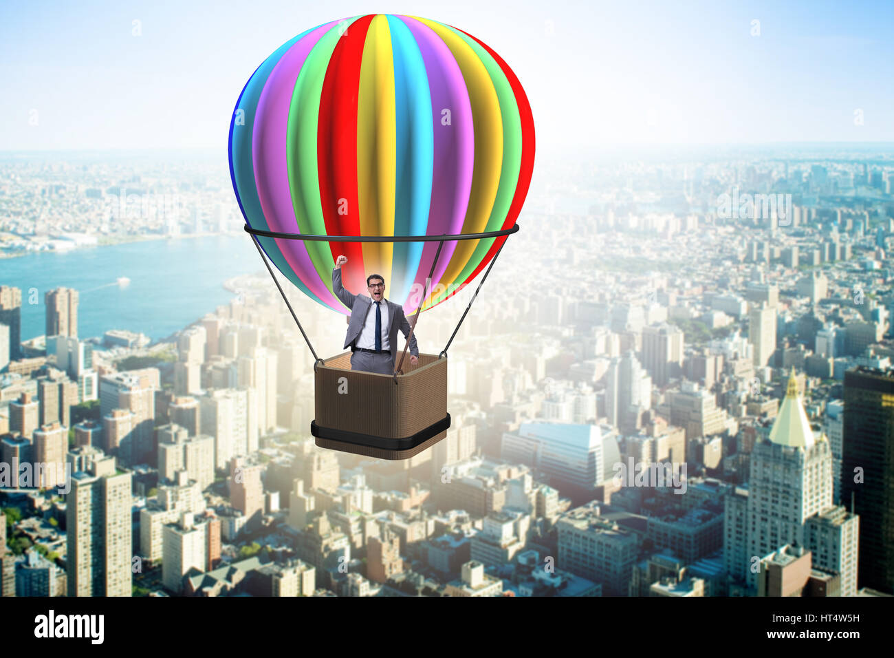 Businessman flying on balloon in challenge concept Stock Photo - Alamy