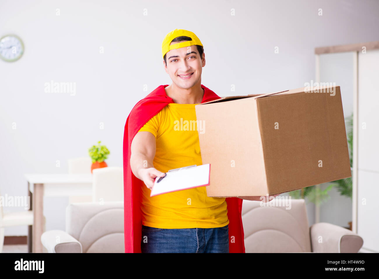 Superhero delivery guy with box Stock Photo - Alamy