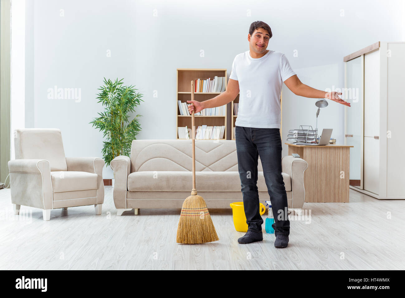 Man husband cleaning the house helping wife Stock Photo - Alamy