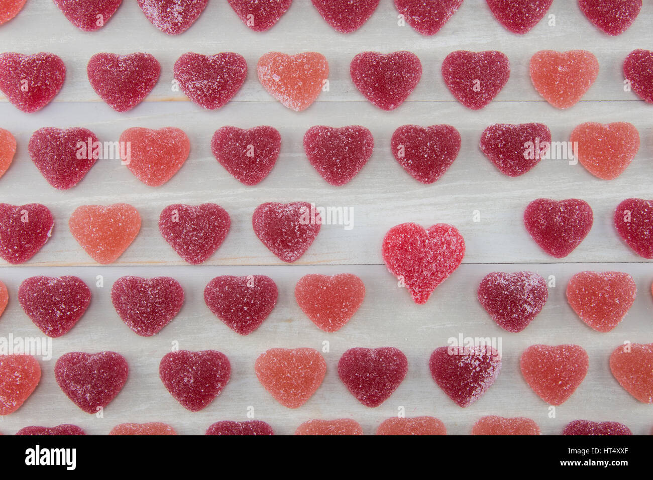 Small Dark Red and Pink Gummy Hearts with One Larger Read Gummy Heart ...