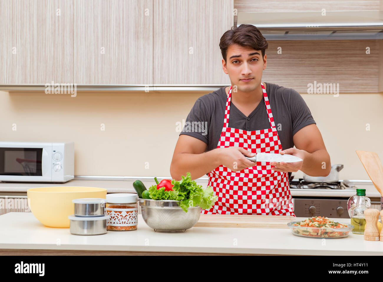 Man male cook preparing food in kitchen Stock Photo - Alamy