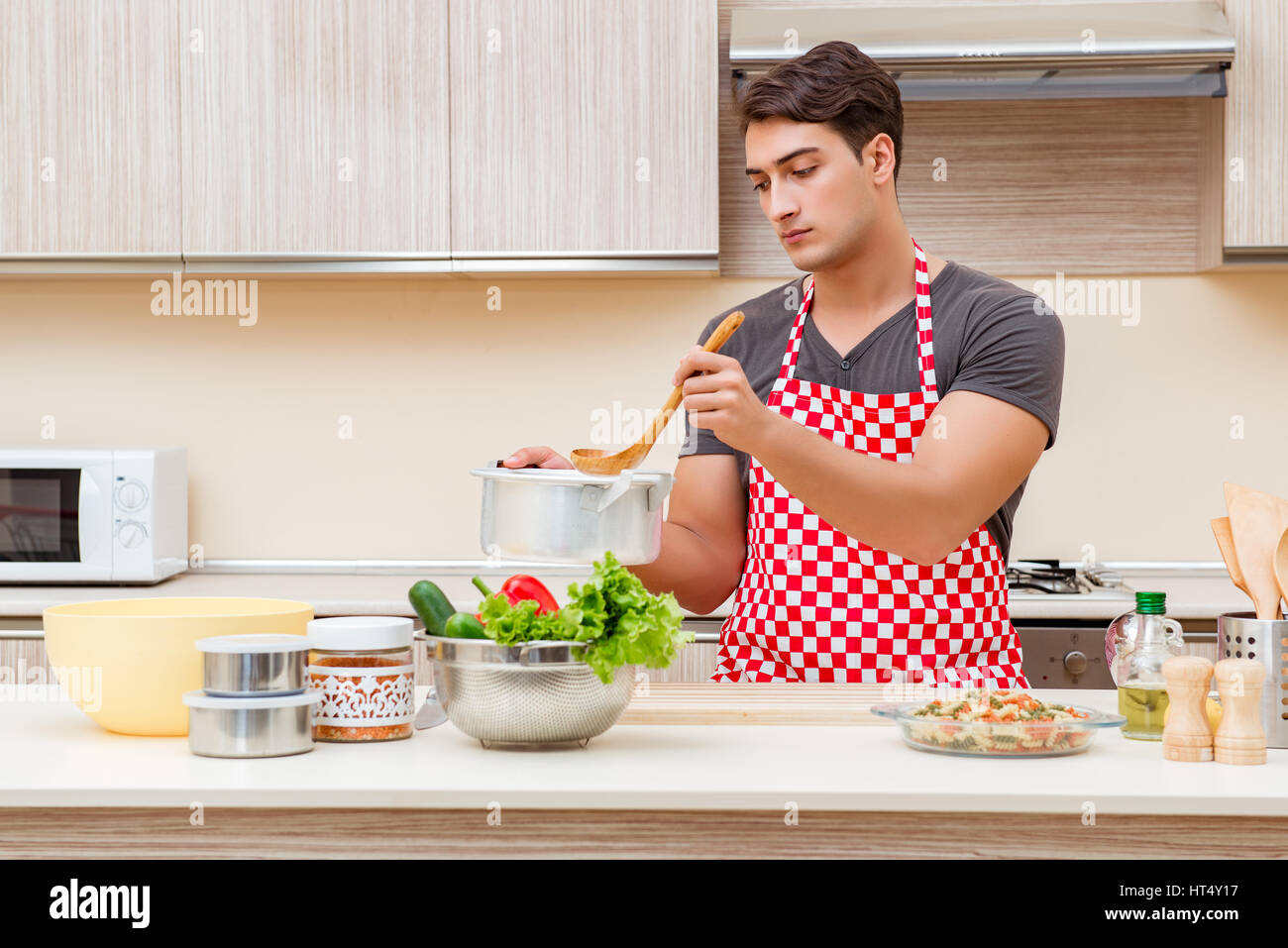 Man male cook preparing food in kitchen Stock Photo - Alamy