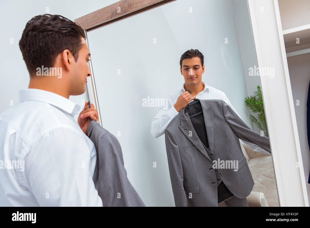 Businessman dressing up for work Stock Photo - Alamy