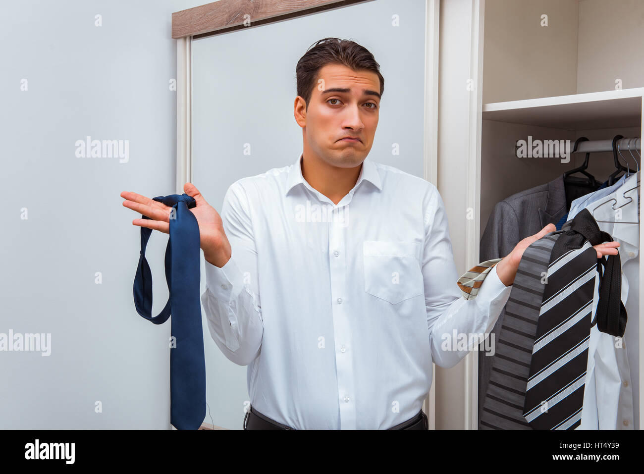 Businessman dressing up for work Stock Photo - Alamy