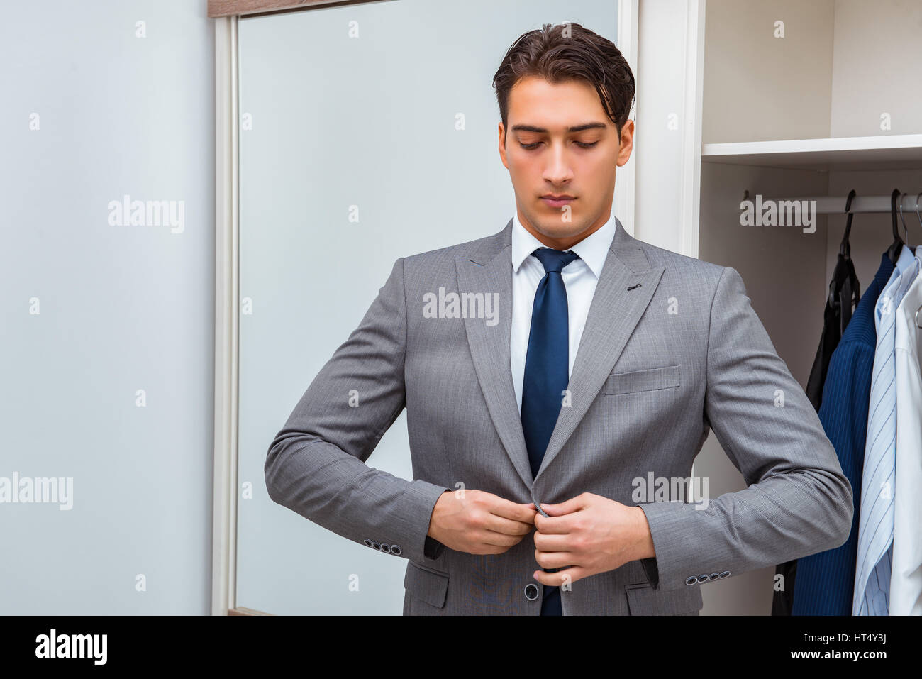 Businessman dressing up for work Stock Photo - Alamy