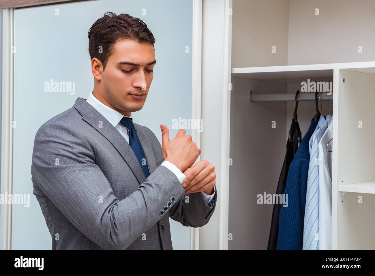 Businessman dressing up for work Stock Photo - Alamy