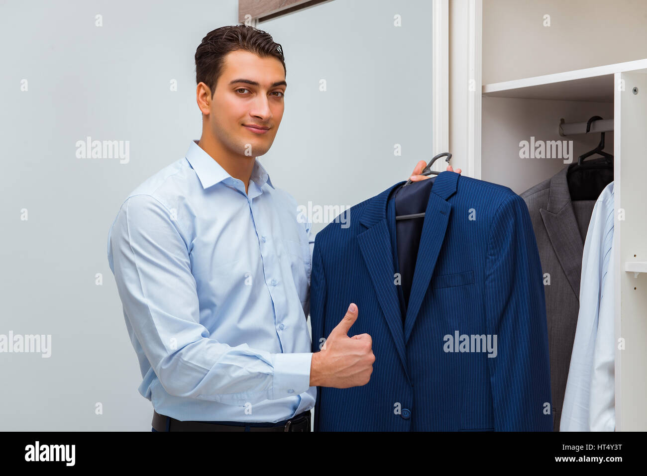 Businessman dressing up for work Stock Photo - Alamy