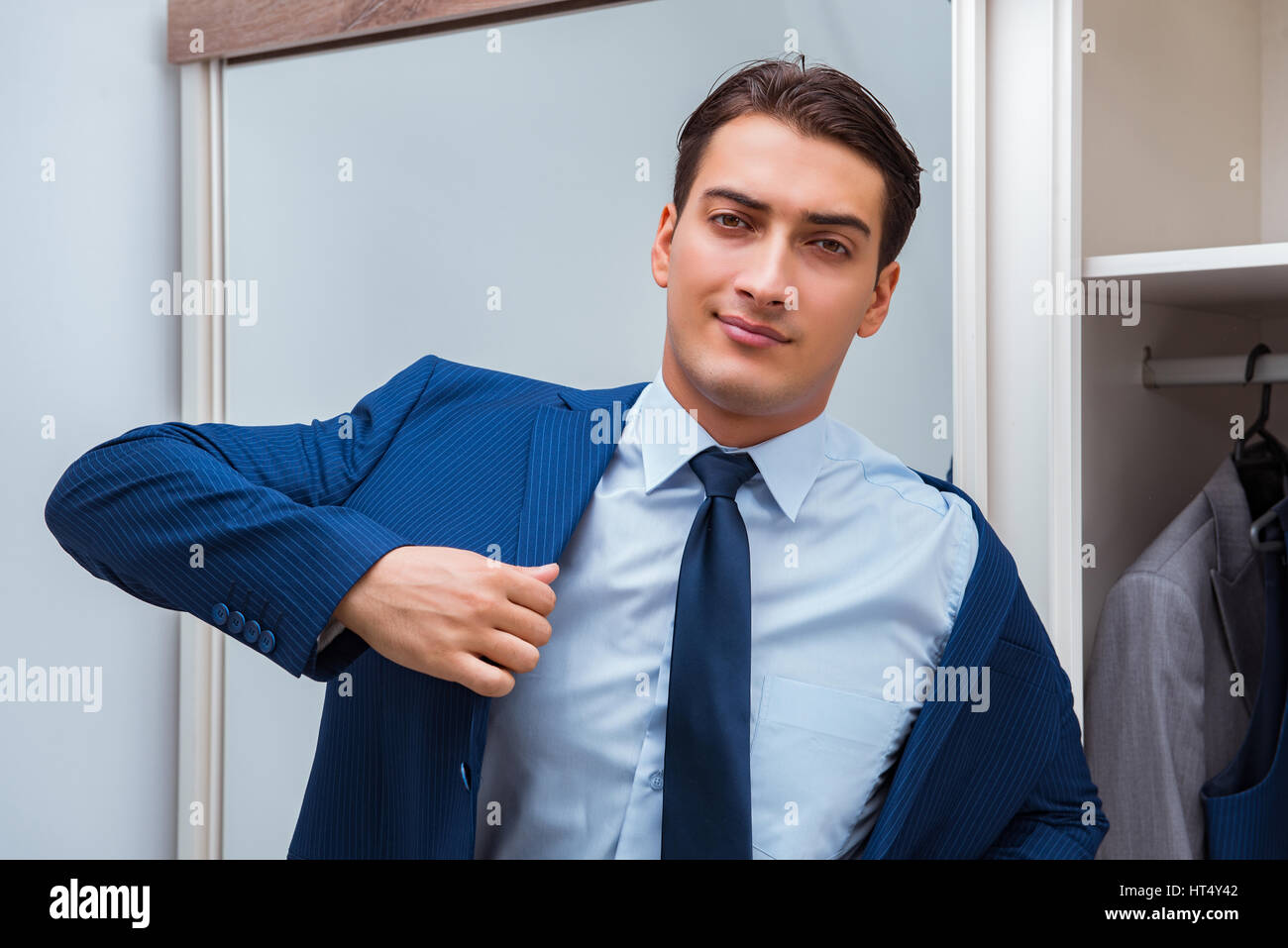 Businessman dressing up for work Stock Photo - Alamy