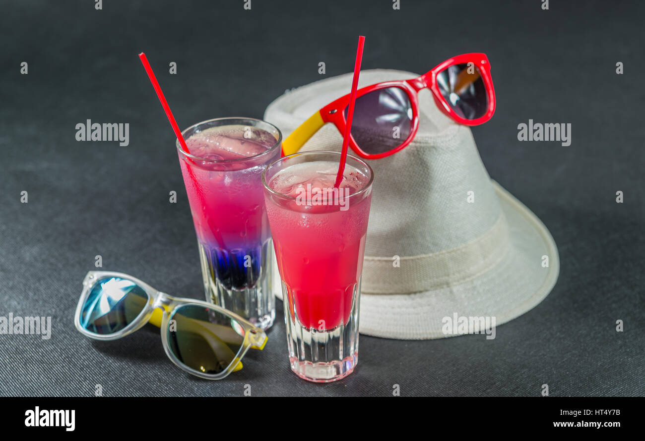 Two colored drinks, a combination of dark blue with purple, the second ...
