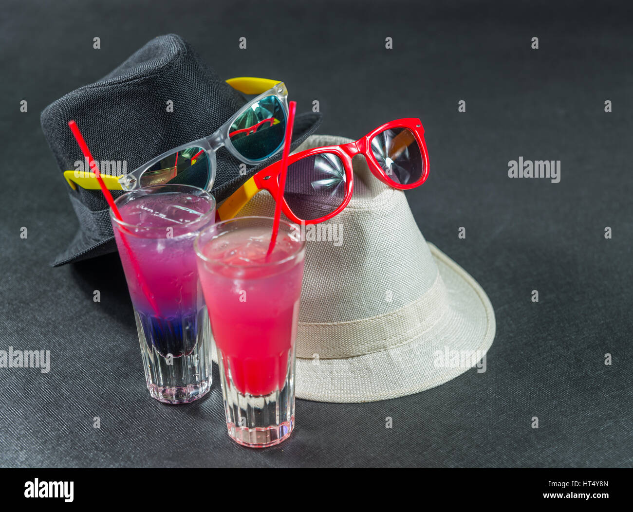 Two colored drinks, a combination of dark blue with purple, the second ...