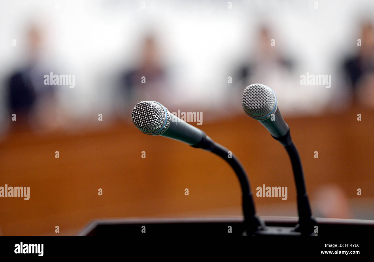 Speaking into two microphones hi-res stock photography and images - Alamy