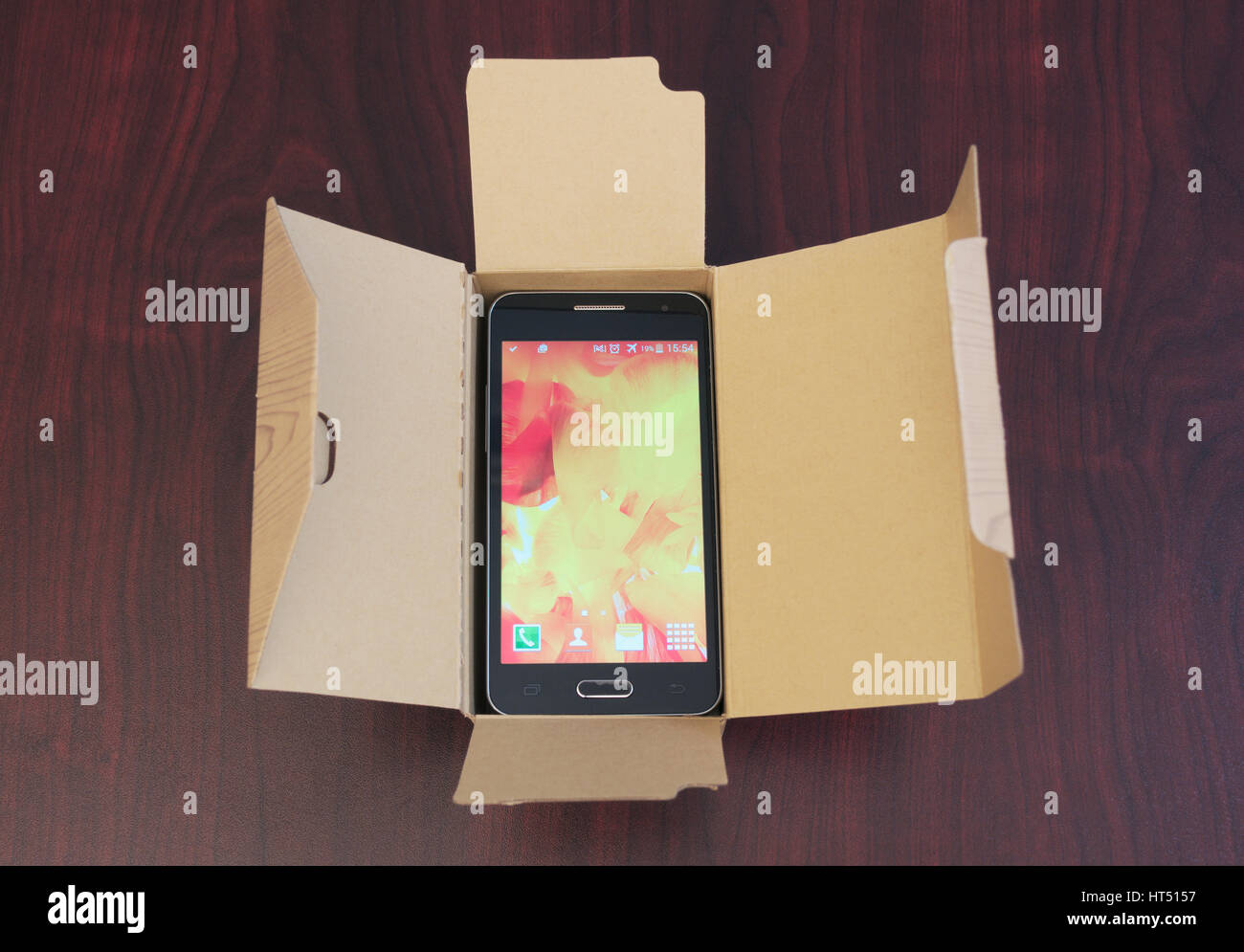 a new smartphone in cardboard box Stock Photo - Alamy