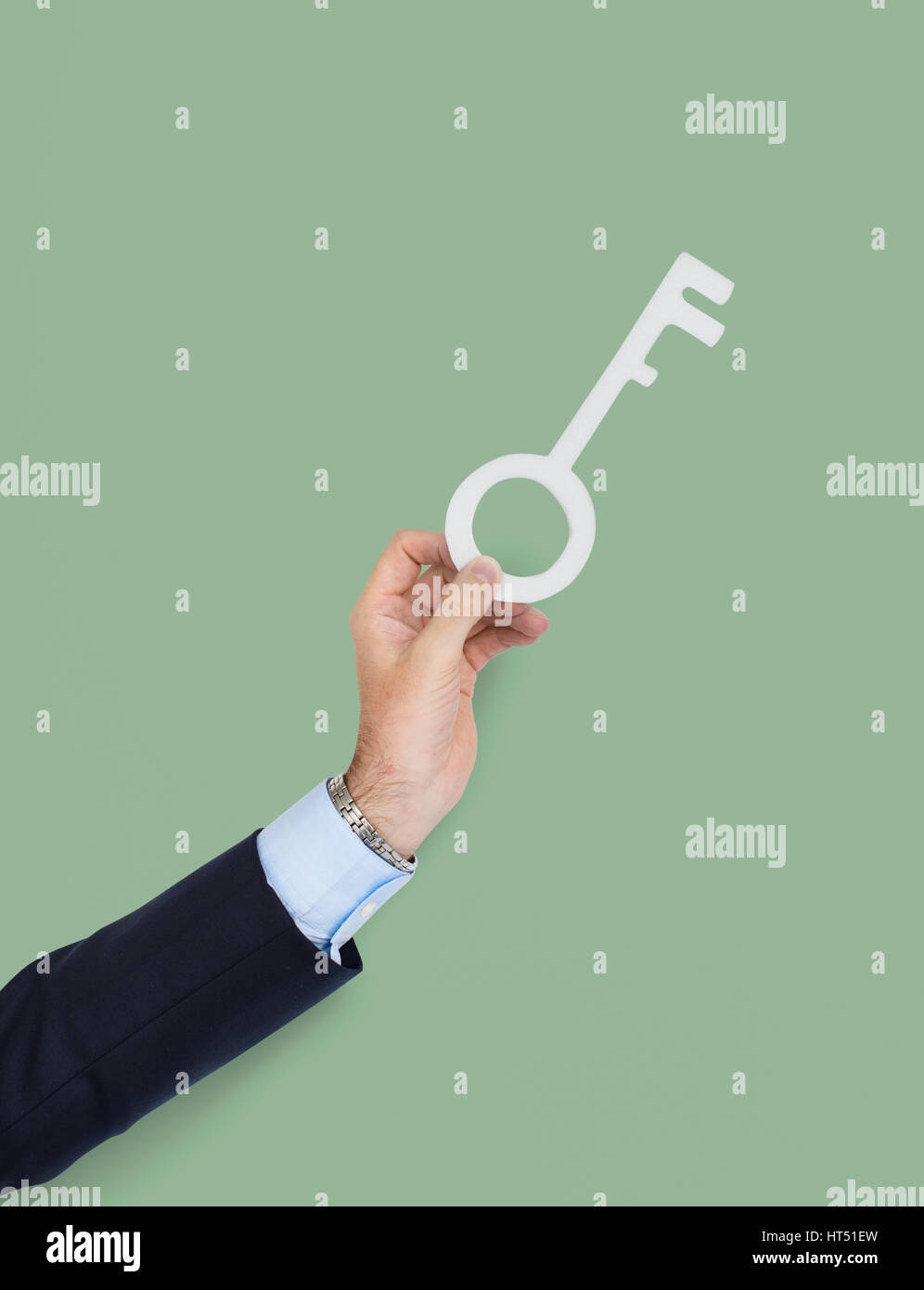 Business Man Holding Key Stock Photo - Alamy