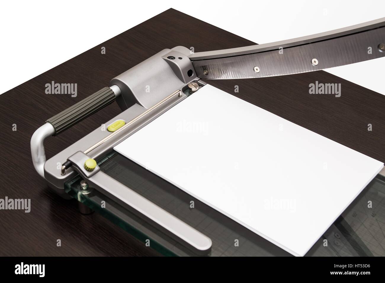 Sheet of paper in the guillotine Stock Photo - Alamy