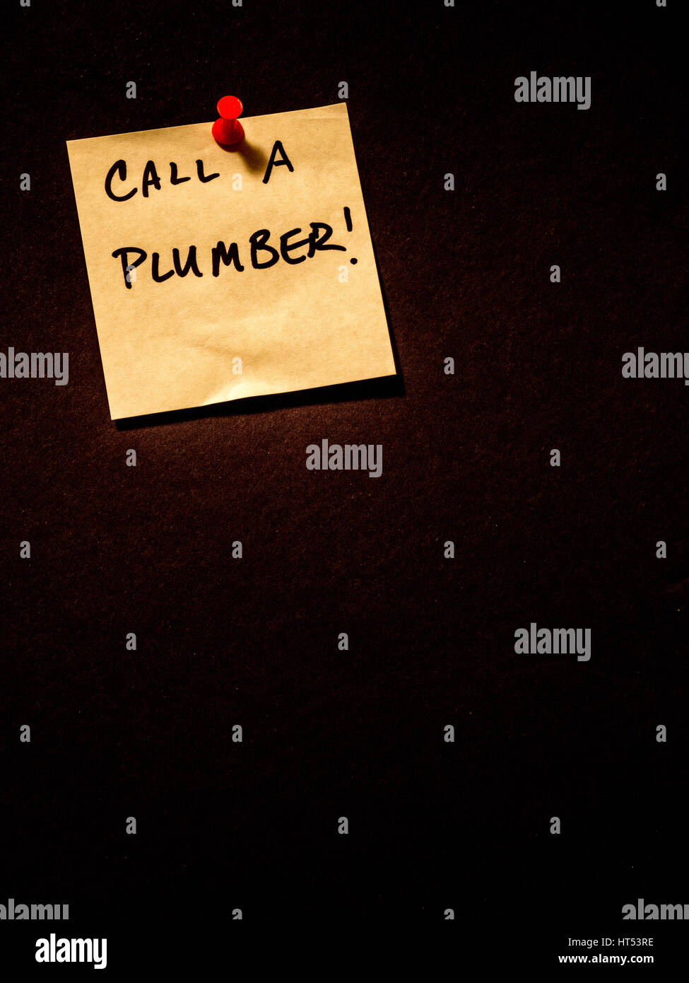 Call a plumber, post it note on black, portrait orientation Stock Photo ...