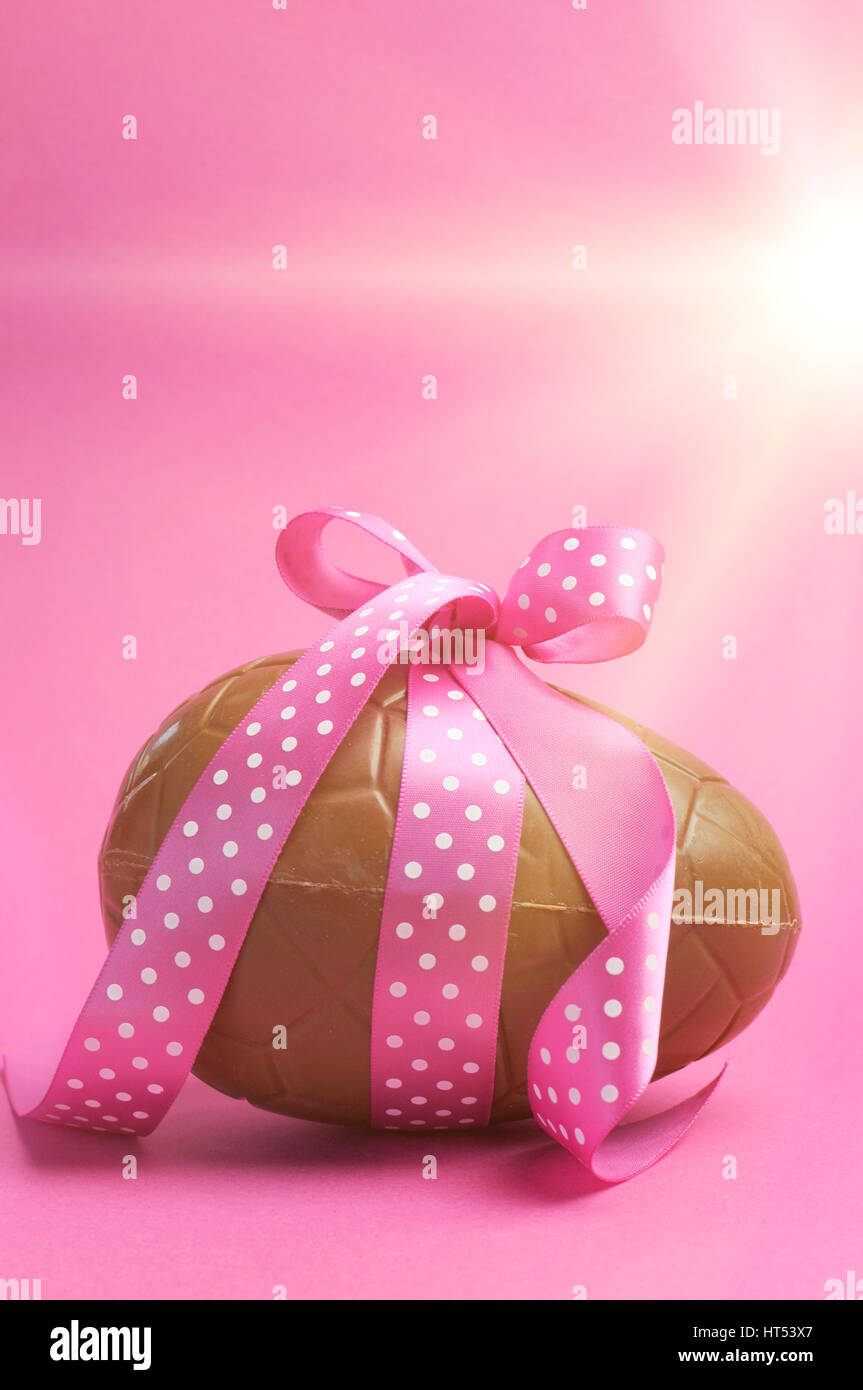 Large Happy Easter chocolate Easter egg with pink polka dot ribbon tied ...