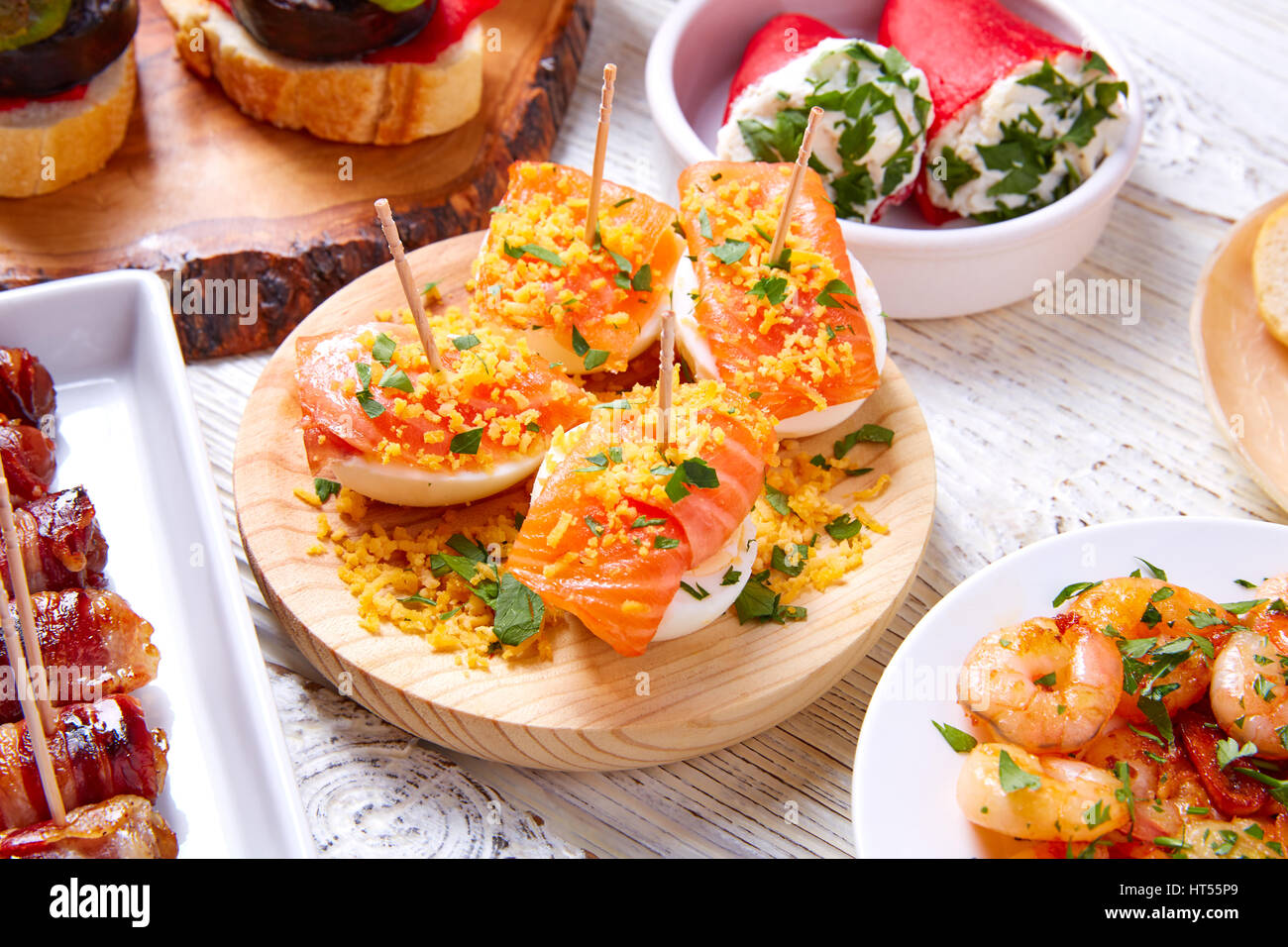 Tapas mix and pinchos food from Spain recipes also pintxos on a white ...