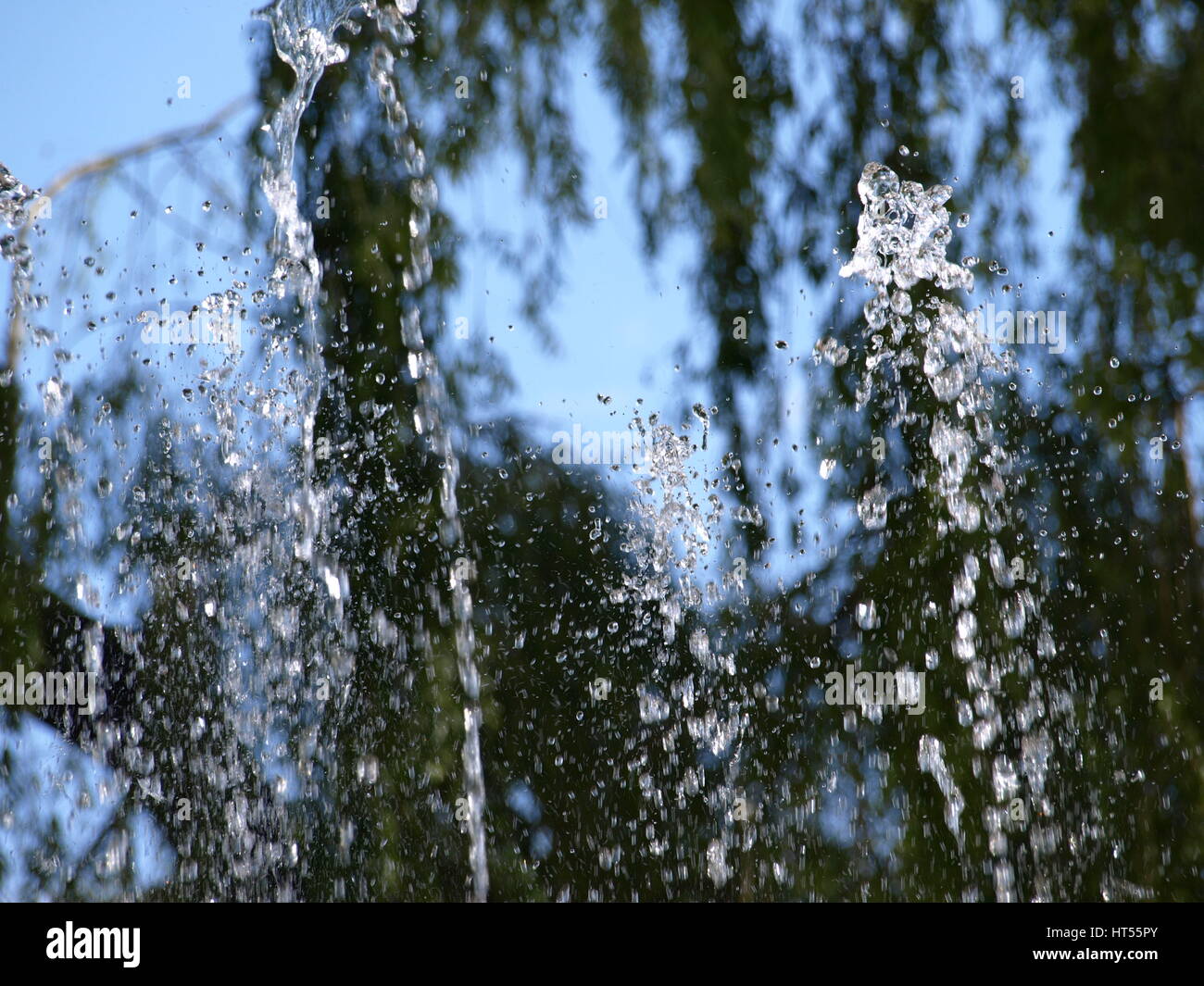 Flowing water and water drops in fountain Stock Photo - Alamy