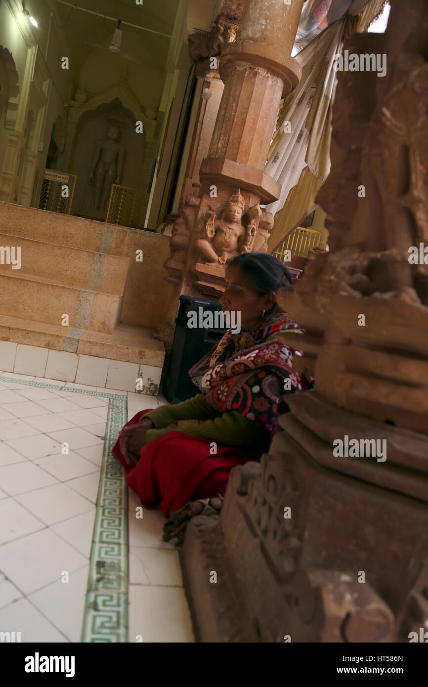 Faithful praying into the temple of Parshvanath temple, Khajuraho ...