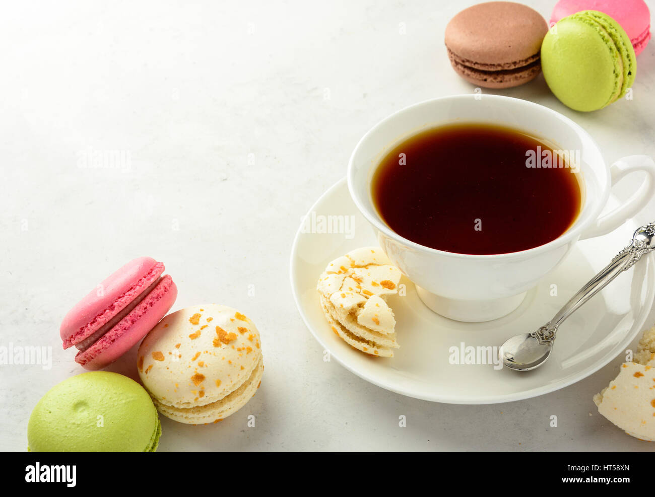 Cup of black tea with tasty almond cookies, rich in vitamins, minerals ...