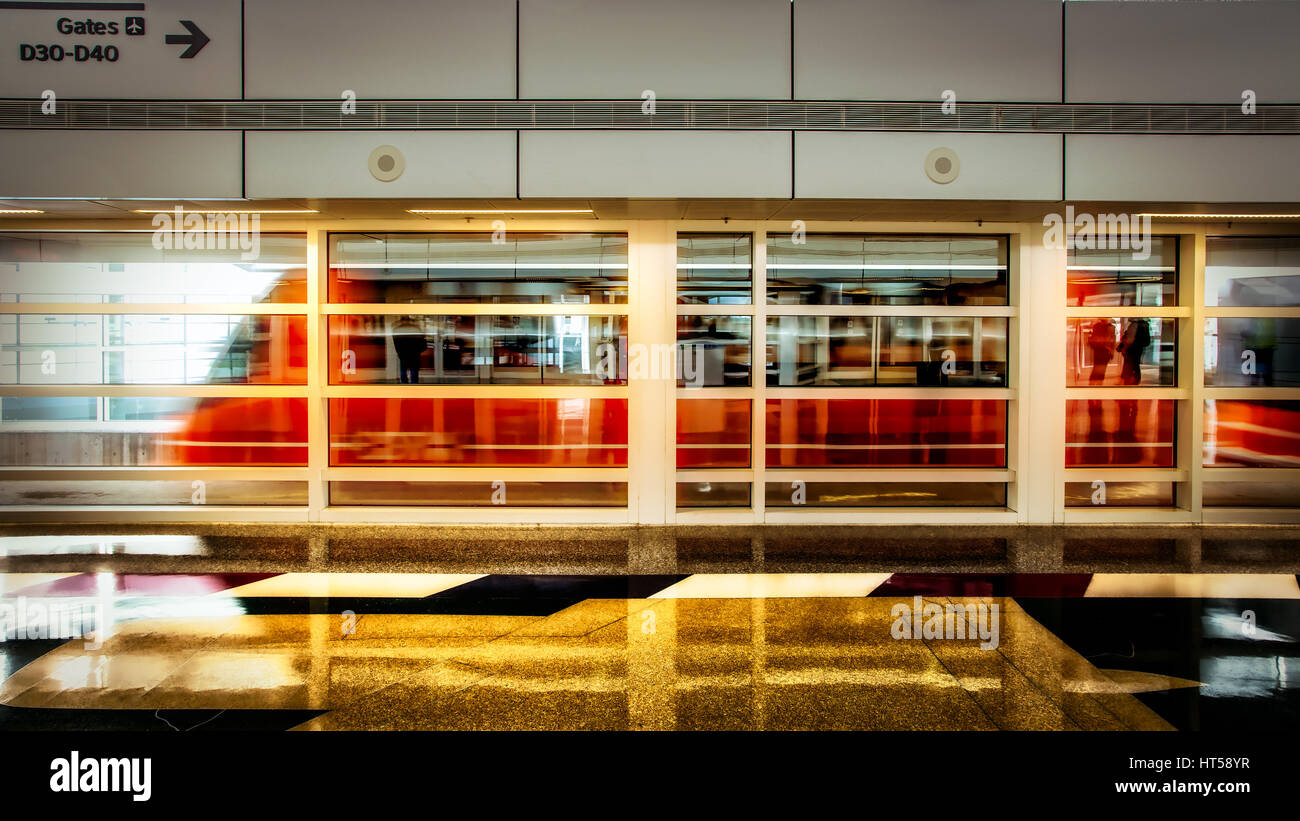 An airport tram arriving at a terminal Stock Photo - Alamy