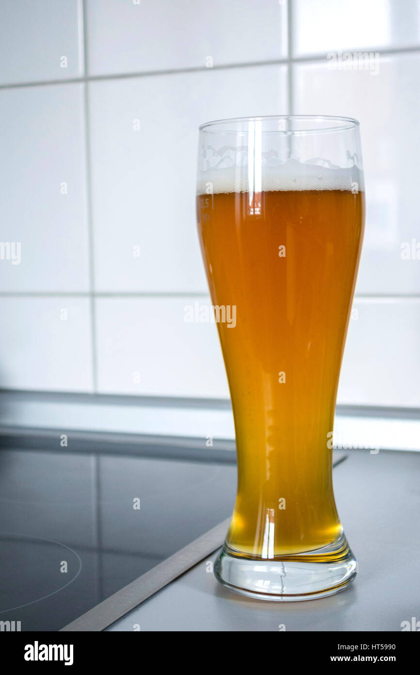Weizenbier glass in a kitchen environment Stock Photo - Alamy