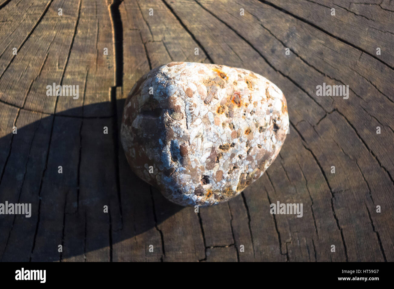 Spa beautiful and unusual decorative pebbles on the old cracked wooden ...