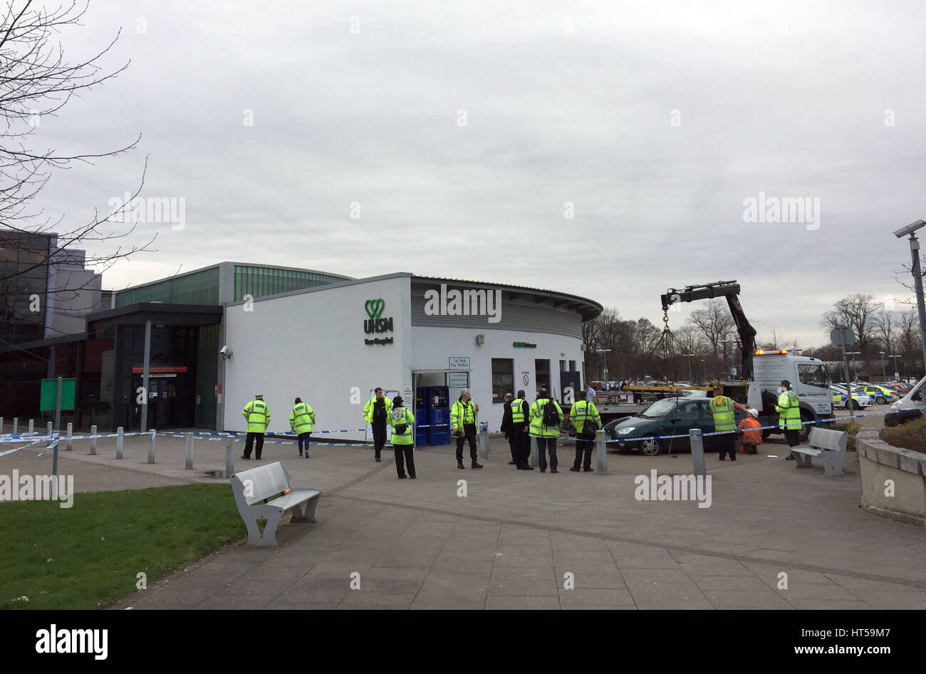 Police at the scene in a car park at Withington Community Hospital in ...
