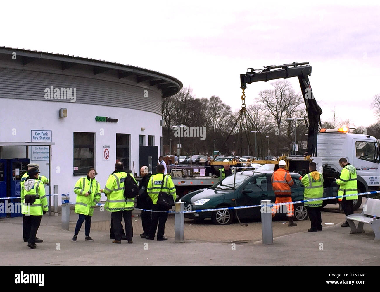 Police at the scene in a car park at Withington Community Hospital in ...
