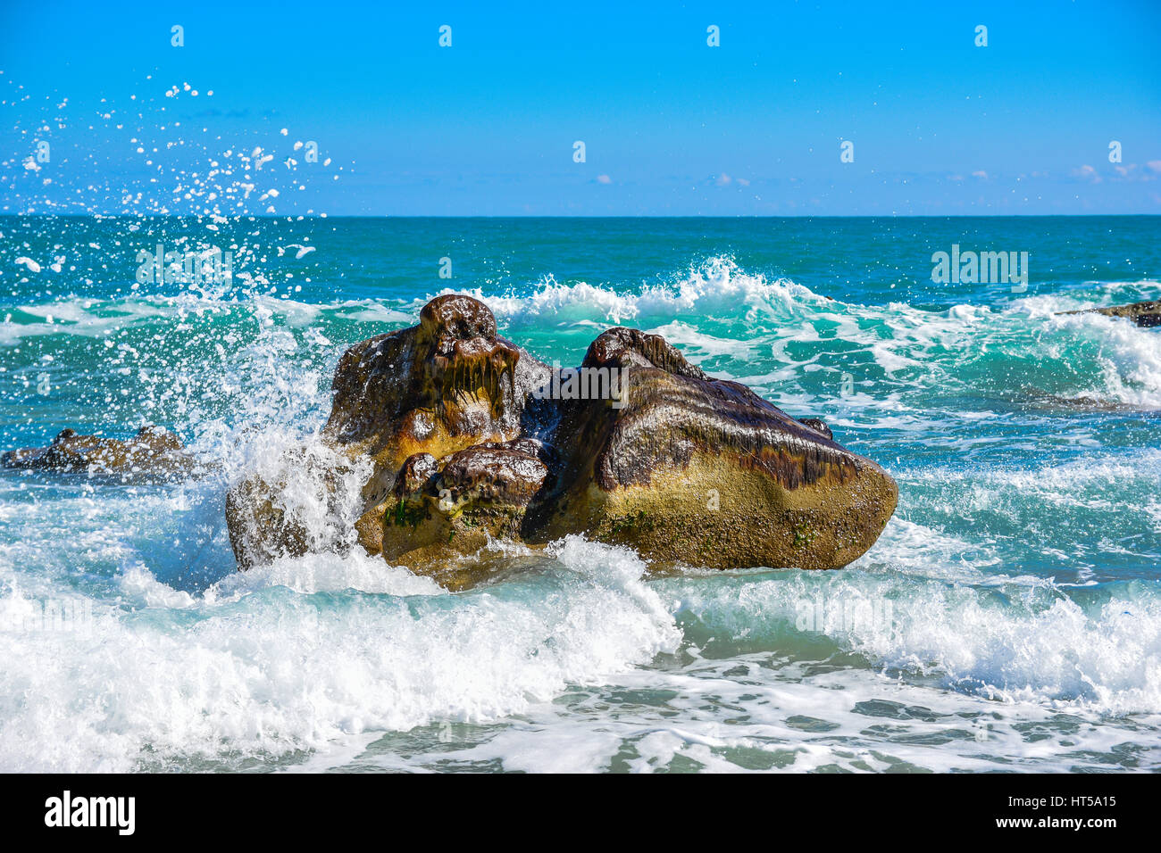 Large wave crash against the rocks at the beach Stock Photo - Alamy